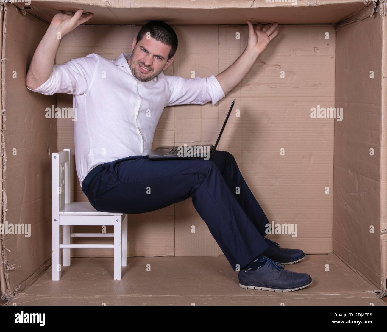 broken businessman in a cardboard office, stress and depression from ...