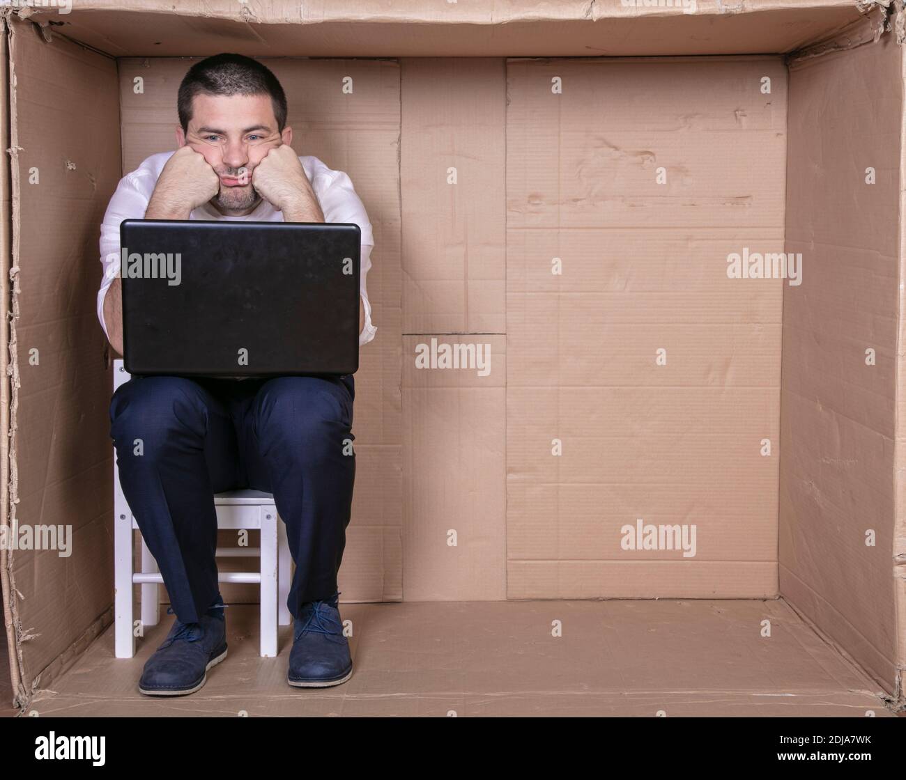 broken businessman in a cardboard office, stress and depression from ...