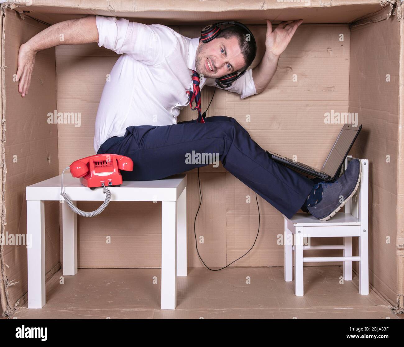 broken businessman in a cardboard office, stress and depression from ...