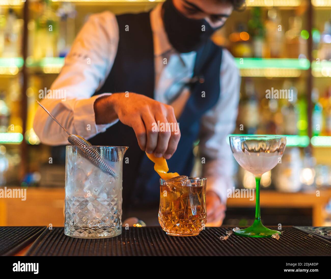 Barman making cocktail at night club Stock Photo - Alamy