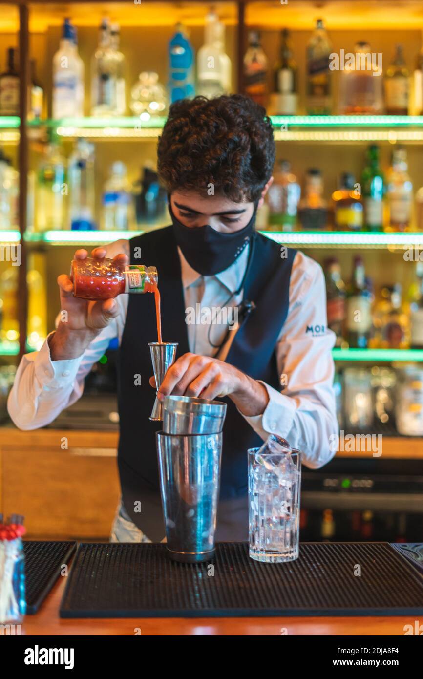 Barman making cocktail at night club Stock Photo - Alamy