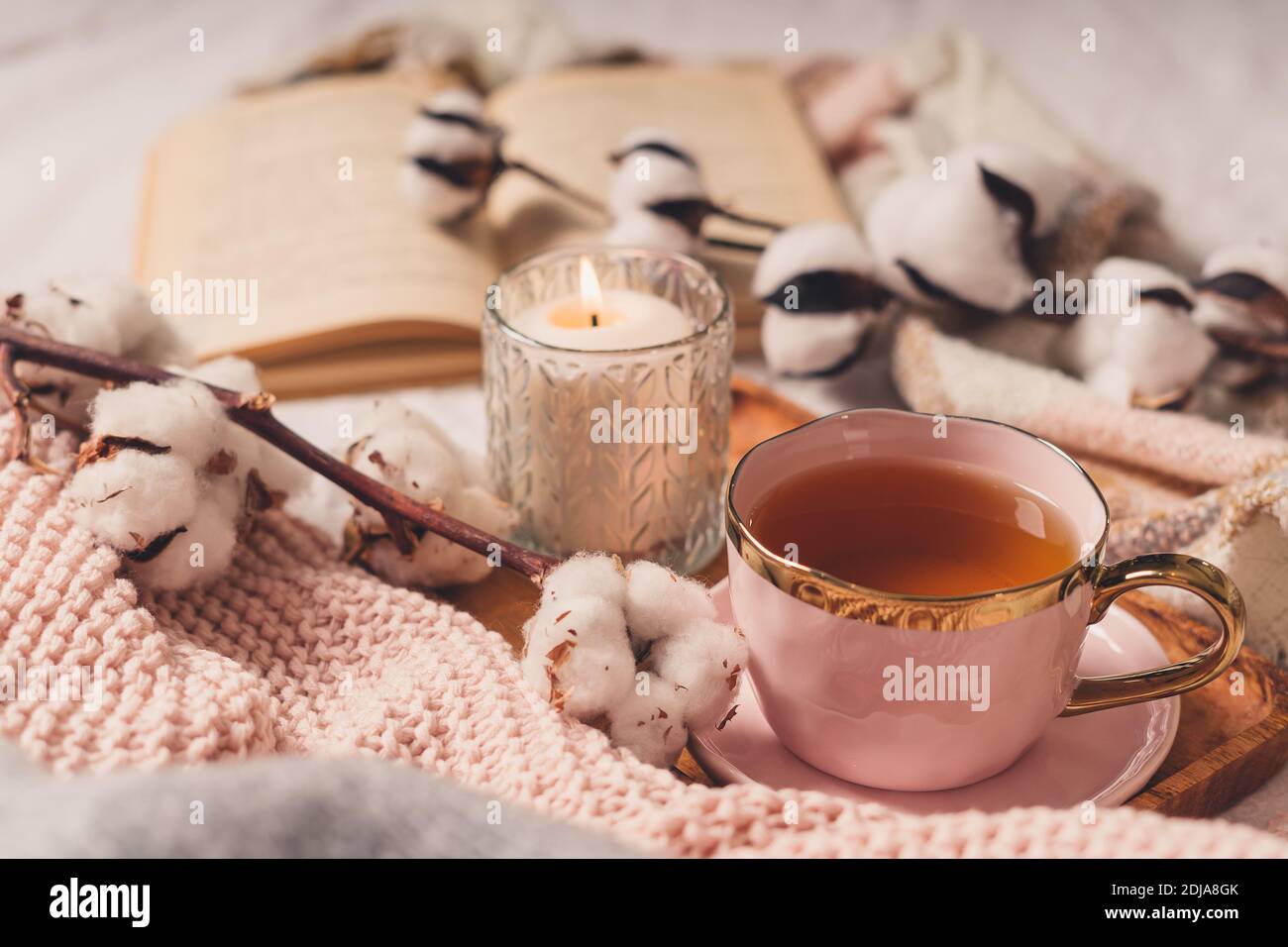 Cup of tea, cotton, cozy, book, candle. Cosy autumn winter concept ...