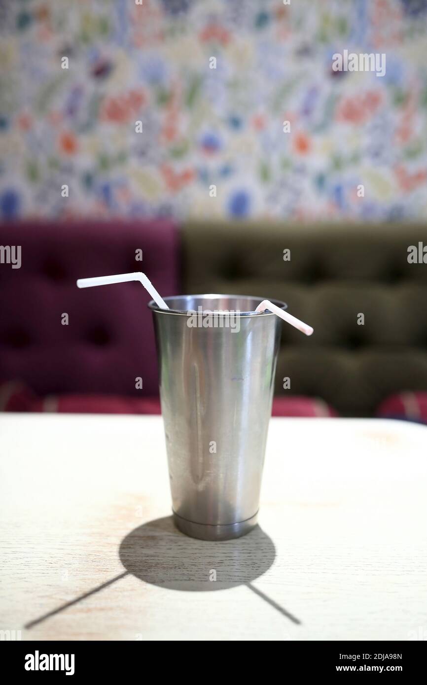 Cocktail in metal mug on a table Stock Photo - Alamy