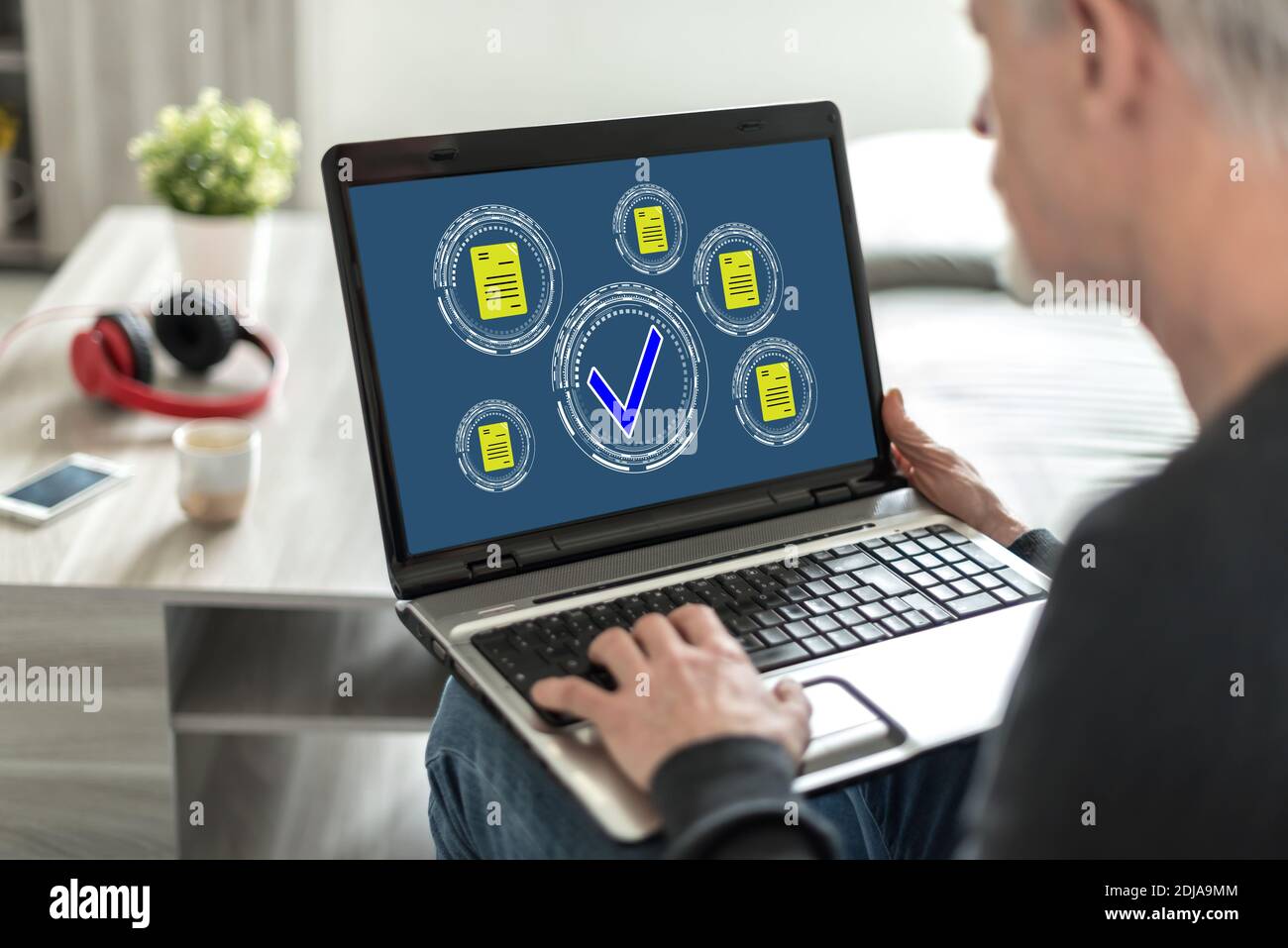 Laptop screen displaying a document validation concept Stock Photo - Alamy