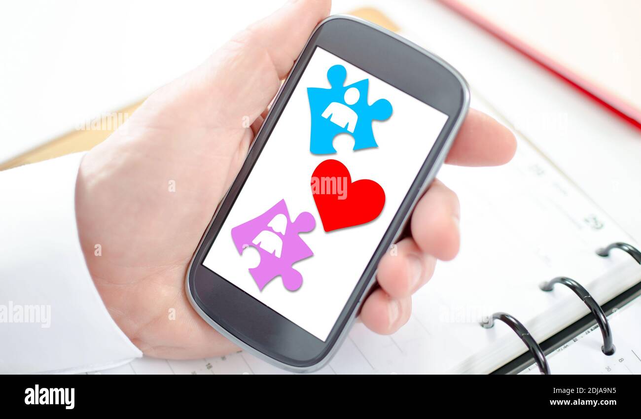 Love concept shown on a smartphone screen Stock Photo - Alamy