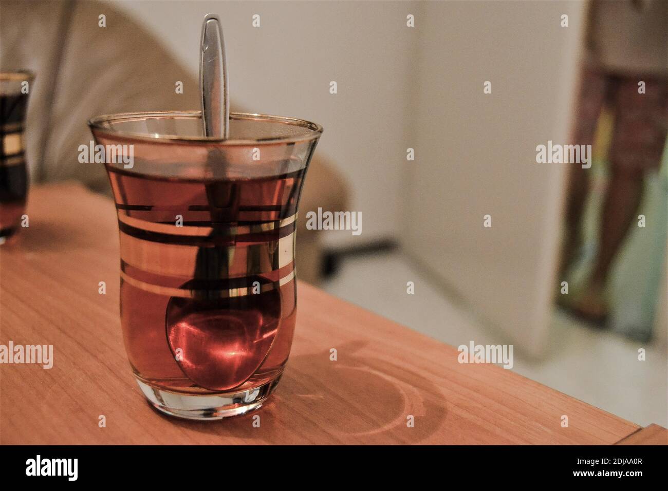 Turkish tea in traditional glass pot and teaspoon Stock Photo - Alamy