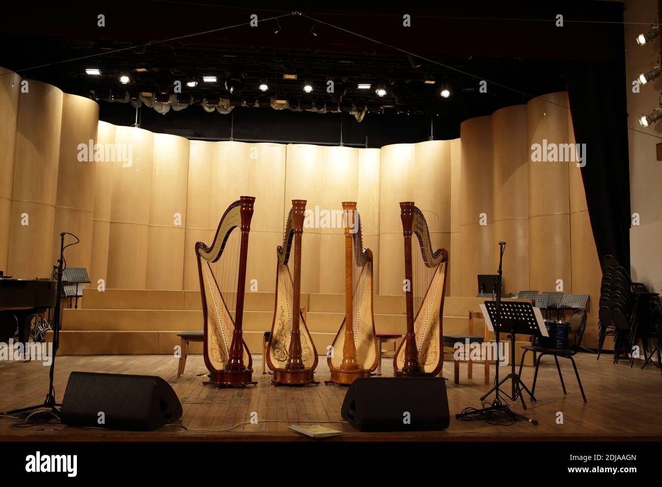 View of four harps on a stage Stock Photo - Alamy