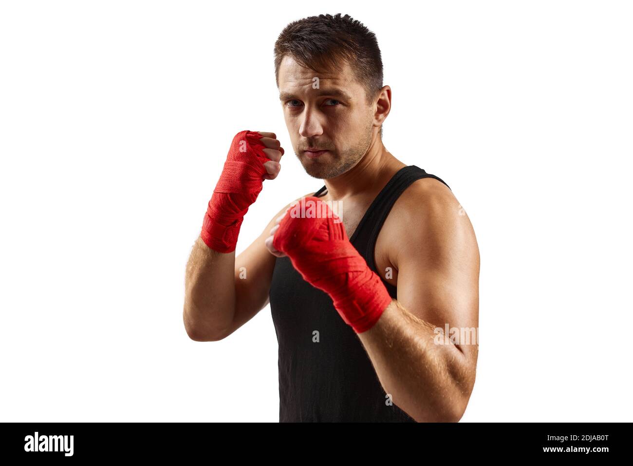 Handsome sporty man in red sports bandages on his hands fighting ...