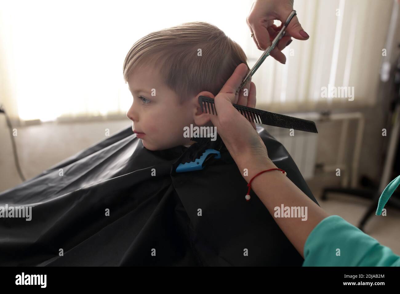 Portrait of a boy in hair salon Stock Photo - Alamy