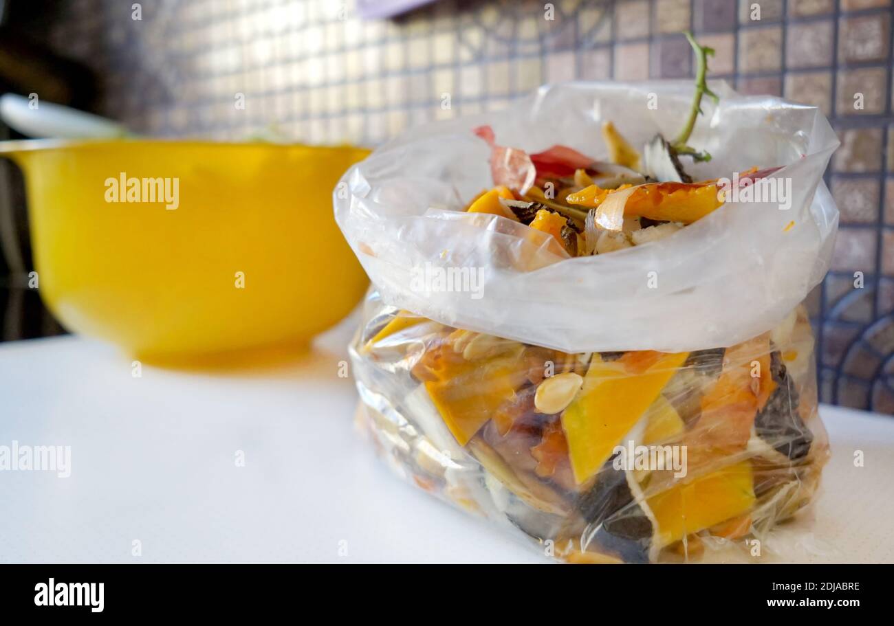 Ecological Compost of vegetables in a transparent plastic pack close-up ...