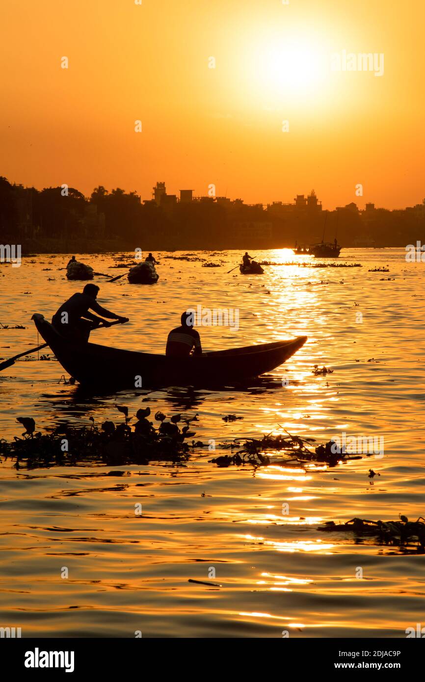 Dhaka, Bangladesh - October 31: Backlight silhouette of a boat on the ...