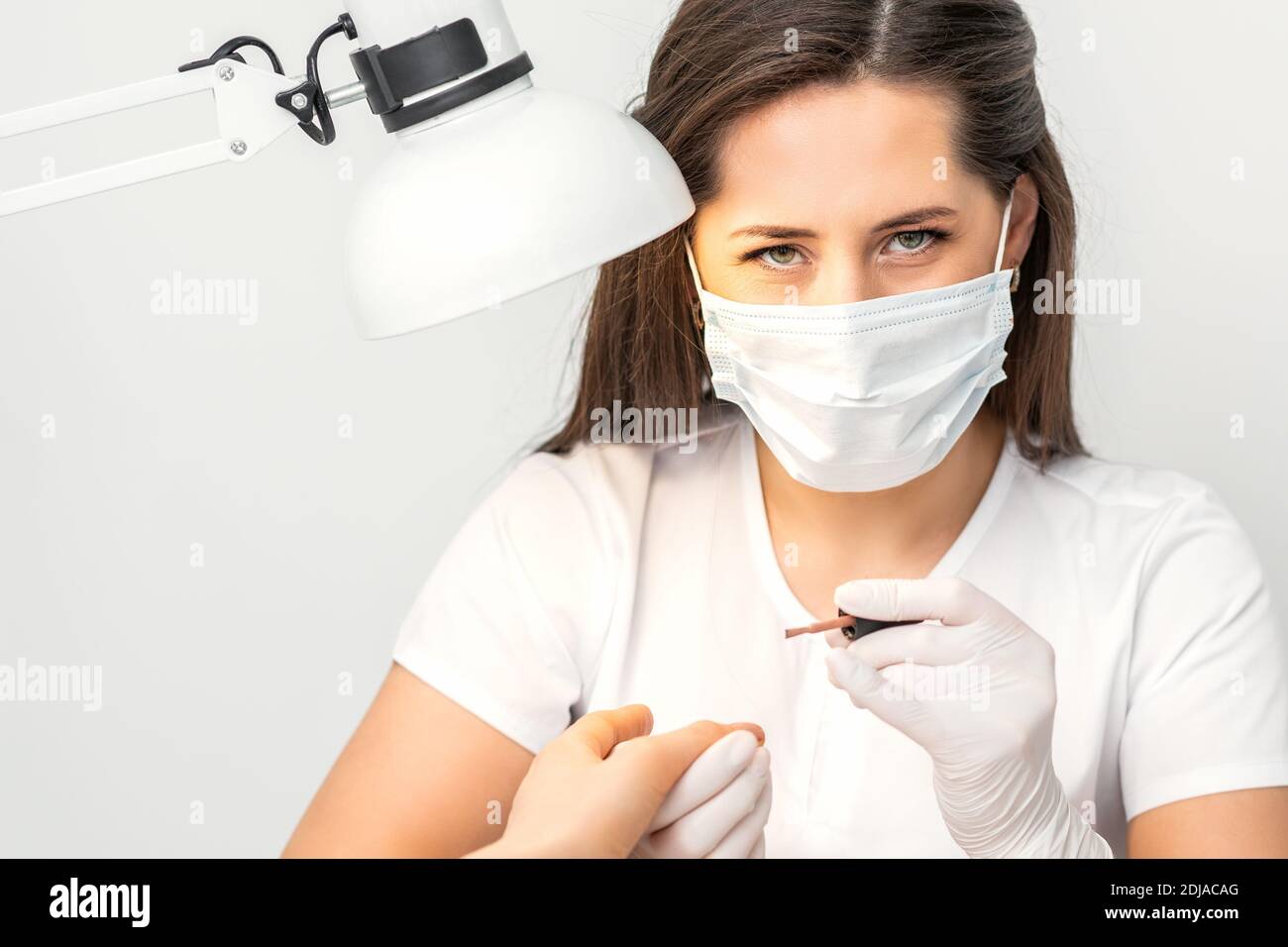 Manicure master in mask gloves hi-res stock photography and images - Alamy