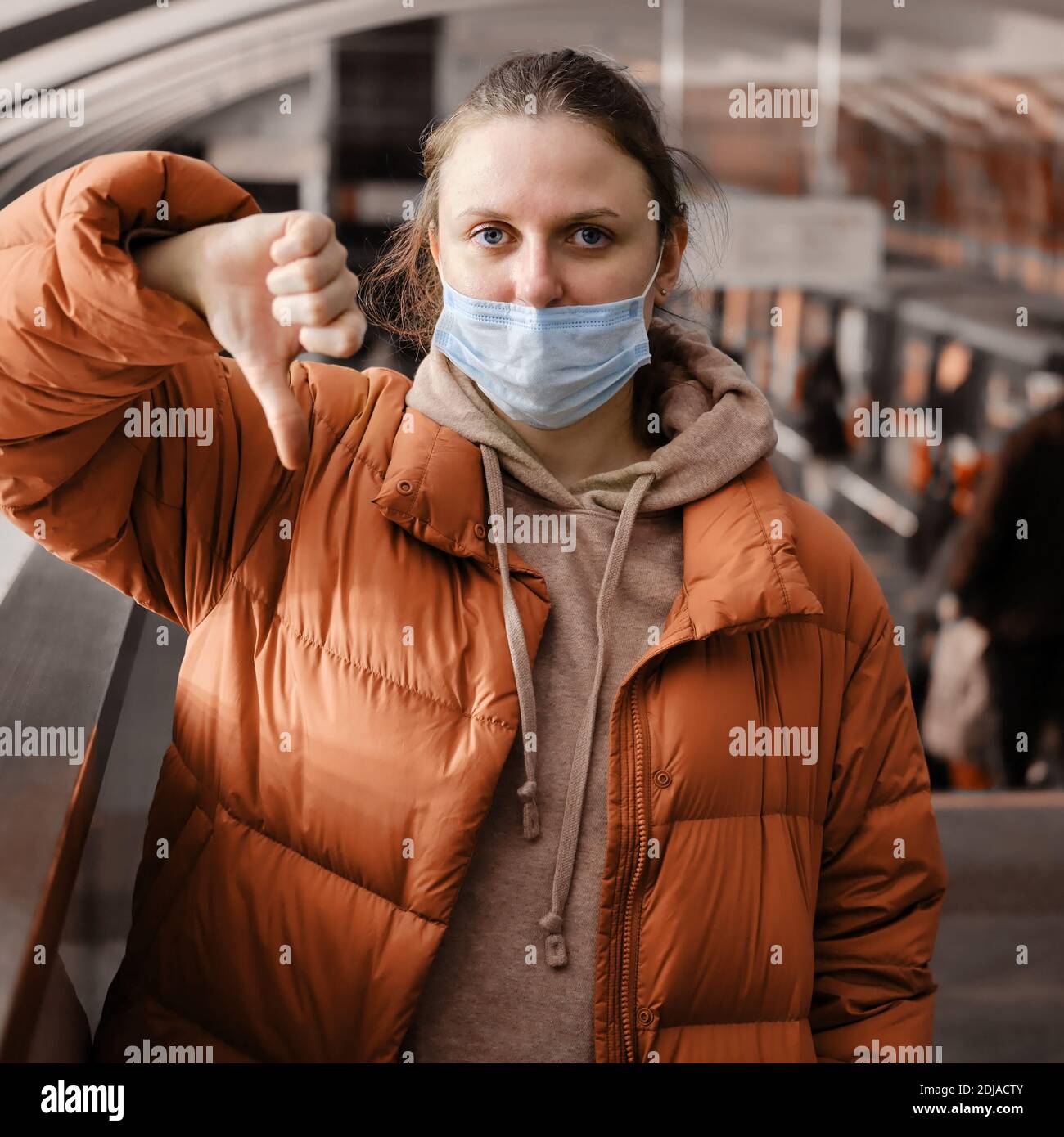 Crookedly wearing medical mask on a passenger in public transport ...