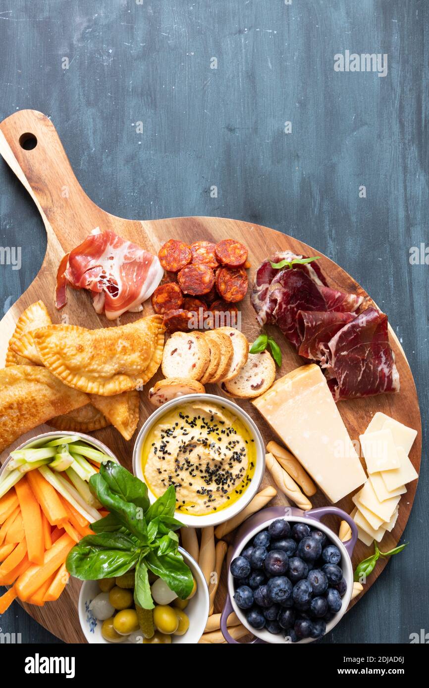 Overhead view of an iberian snack table with spanish typical food on it ...