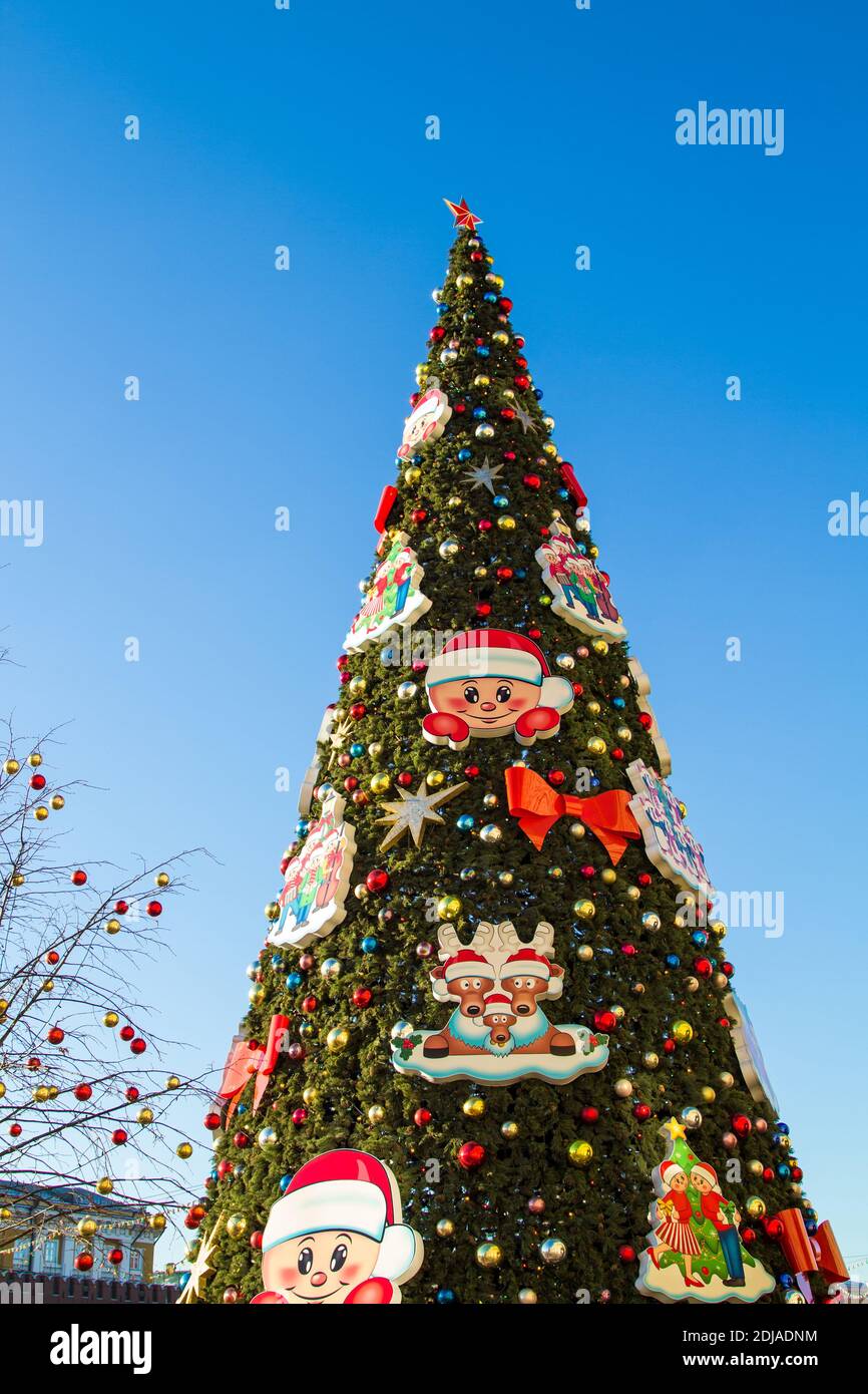 Artificial Christmas tree with cartoon characters Stock Photo - Alamy