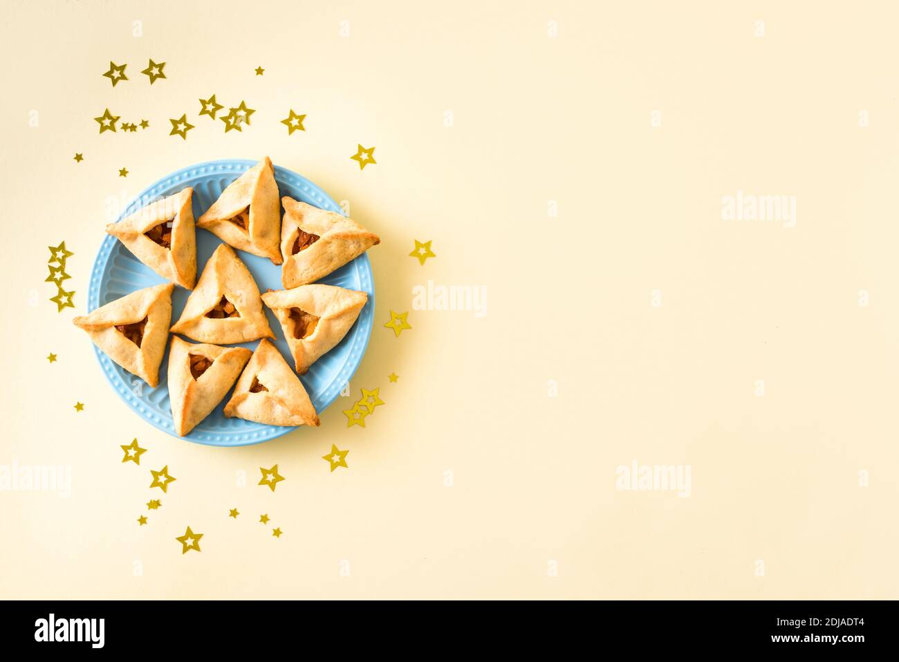 Jewish Purim Hamantaschen homemade biscuits or cookies on blue plate ...