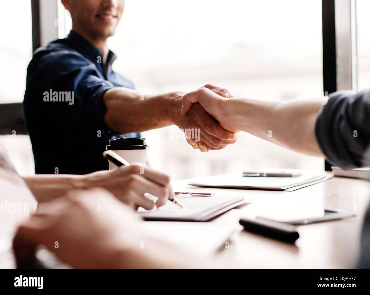 close up. young business people entering into a new contract Stock ...