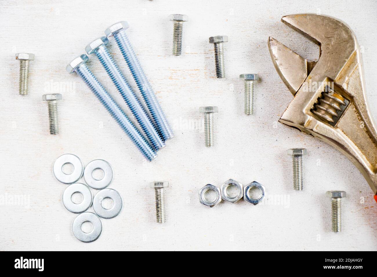 Monkey wrench and bolts on the white background, high angle view Stock ...