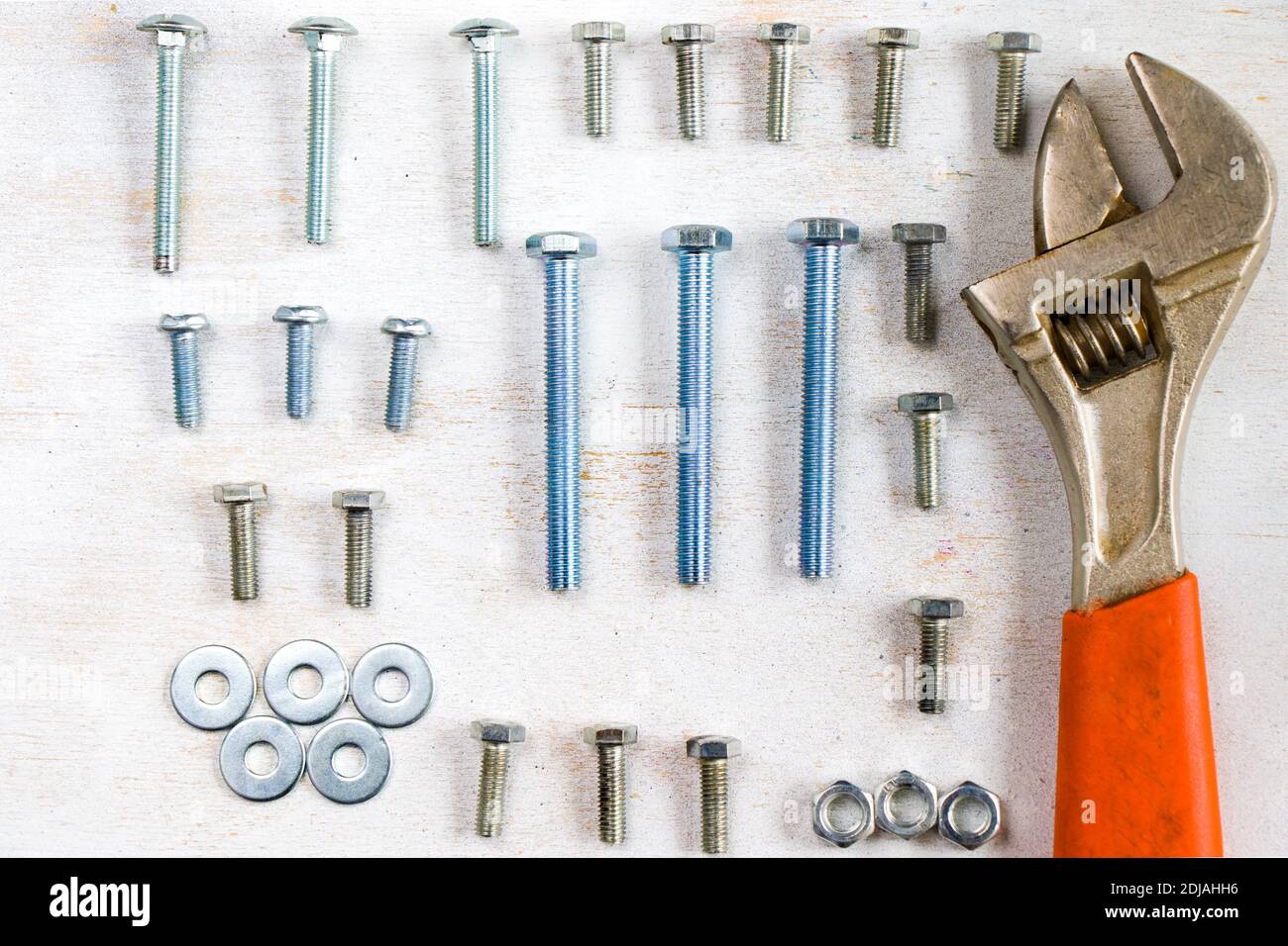 Monkey wrench and bolts on the white background, high angle view Stock ...