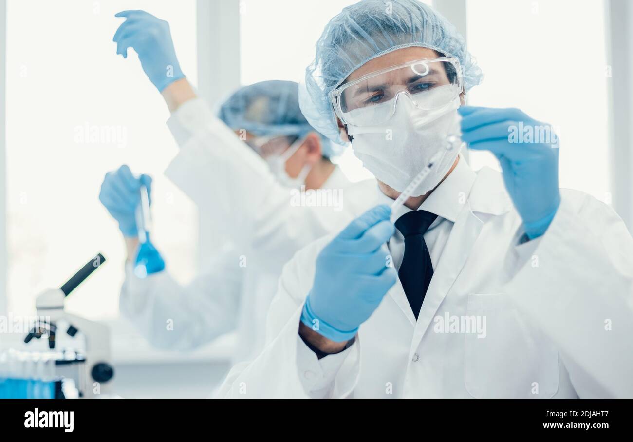 background image of a laboratory assistant in a medical laboratory ...