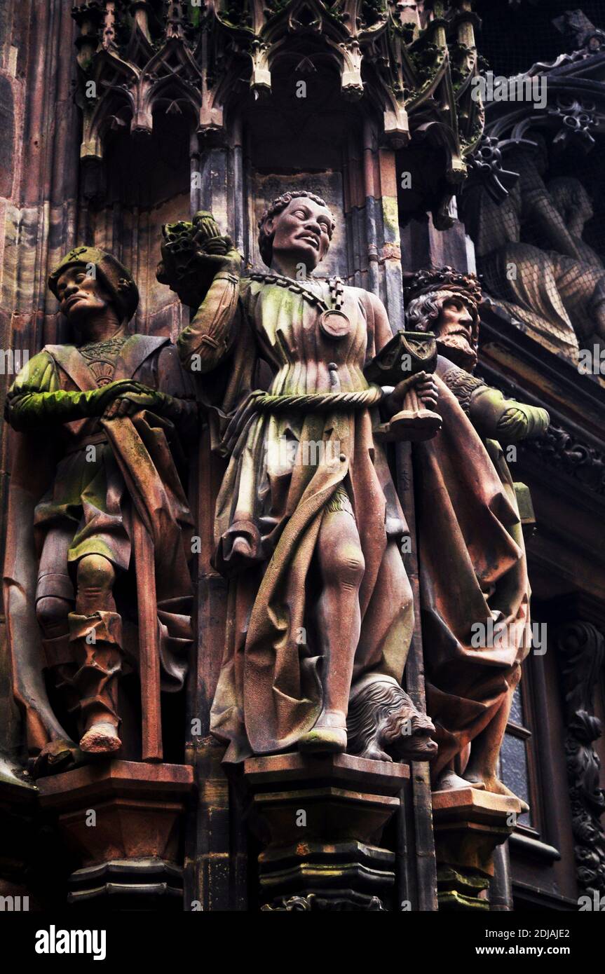 Ancient priest statue and ruin building of Strasbourg Church or the ...