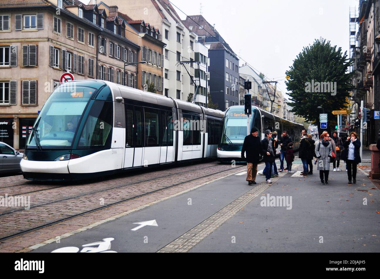 French people and travelers foreign walking and waiting tramway and bus ...
