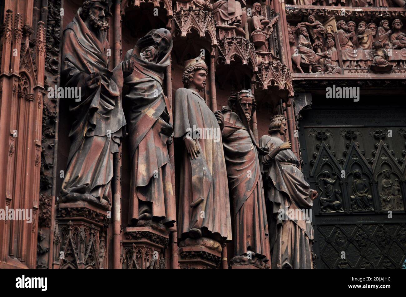 Ancient priest statue and ruin building of Strasbourg Church or the ...