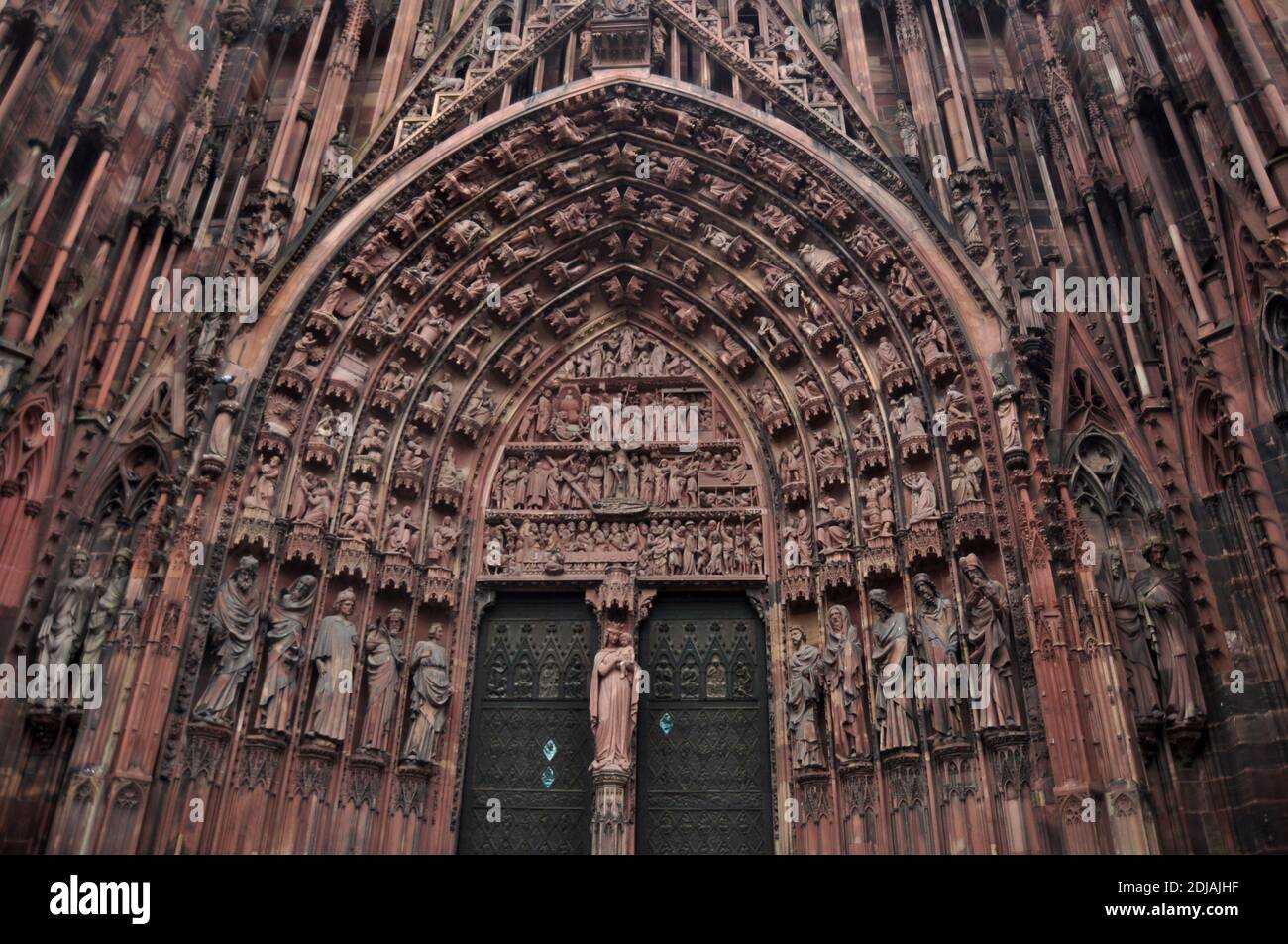 Ancient priest statue and ruin building of Strasbourg Church or the ...