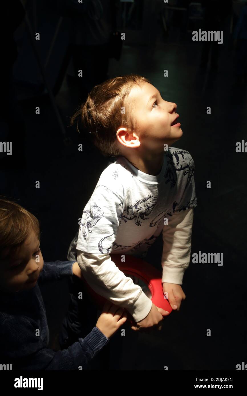 Children playing with light at indoor playground Stock Photo - Alamy