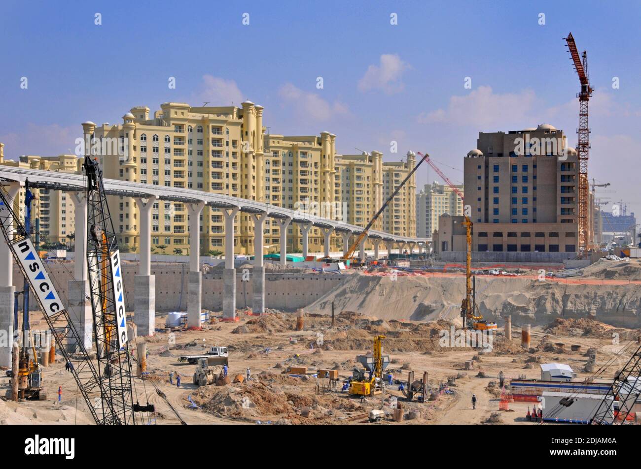 Palm Island cranes & workers on construction building site development ...