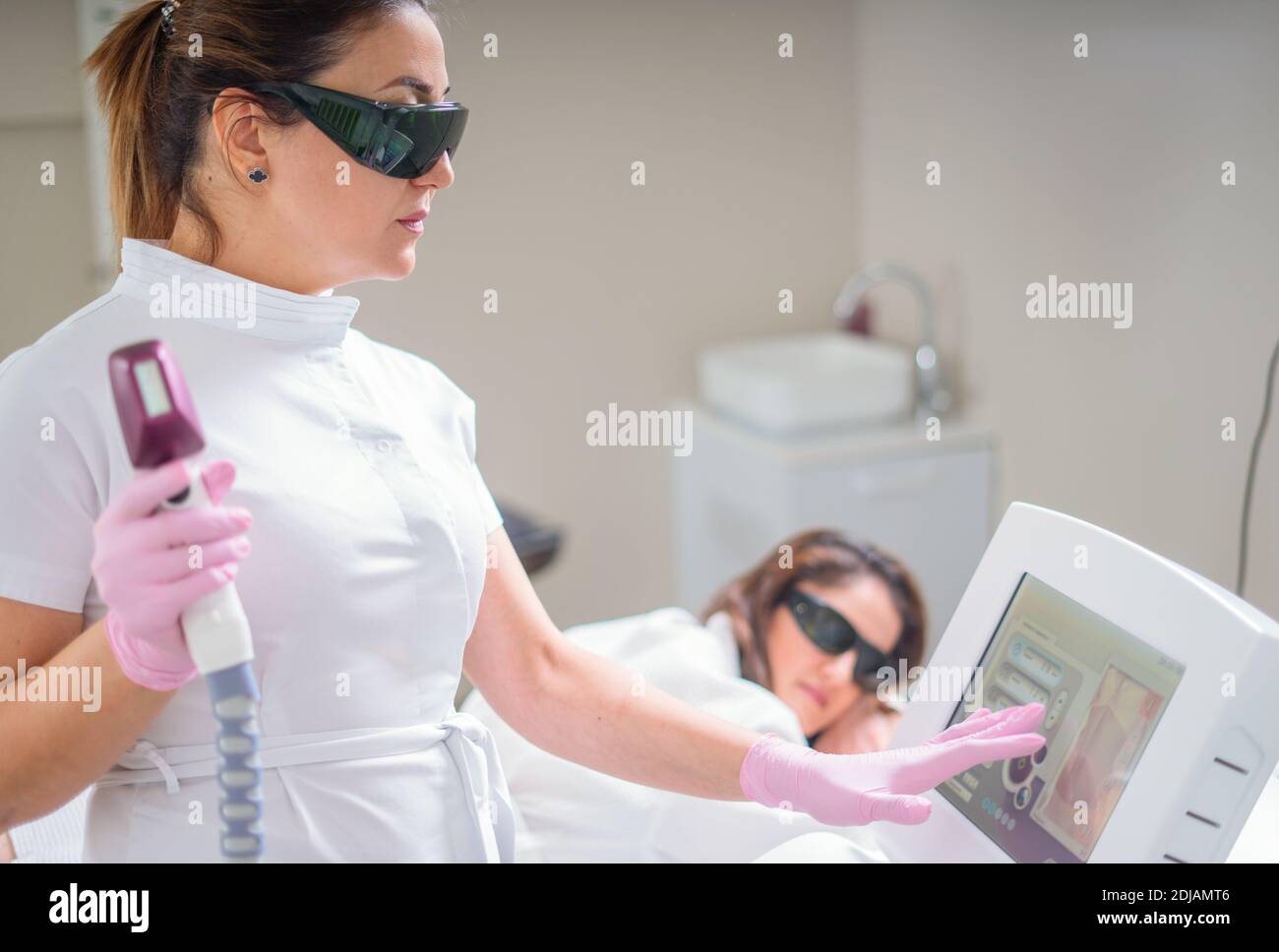 woman in professional beauty clinic during laser hair removal ...
