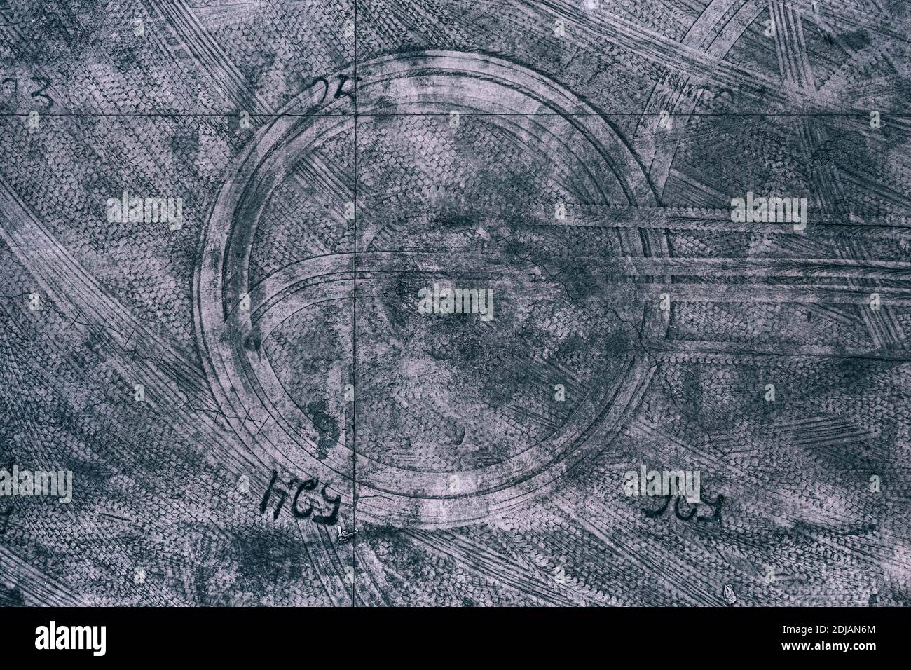Dirty concrete floor with numbers in industrial warehouse building ...