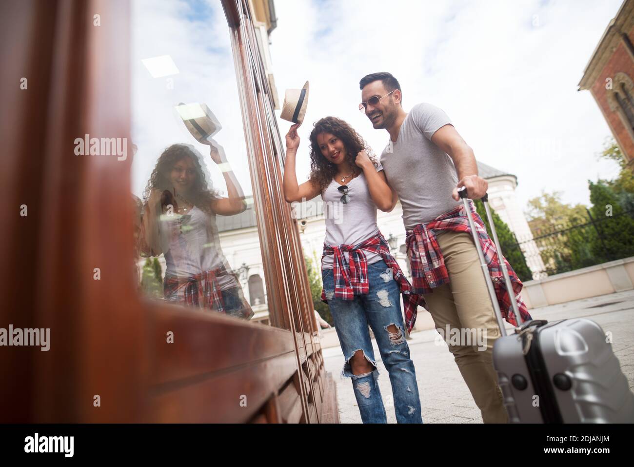 Young beautiful couple is looking trough shop window and their ...