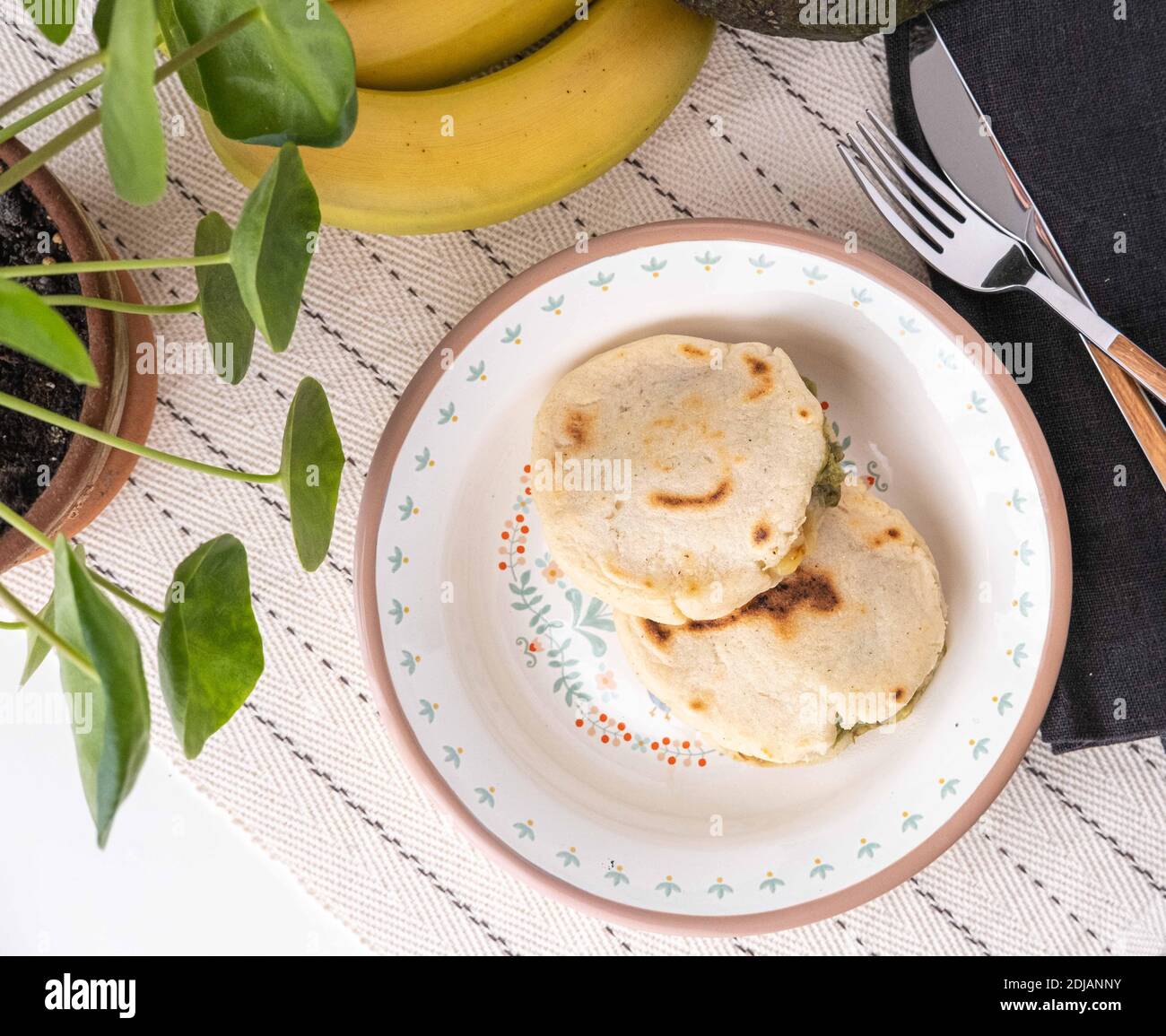 Home made venezuelan Arepas with avocado, banana and cheese Stock Photo ...