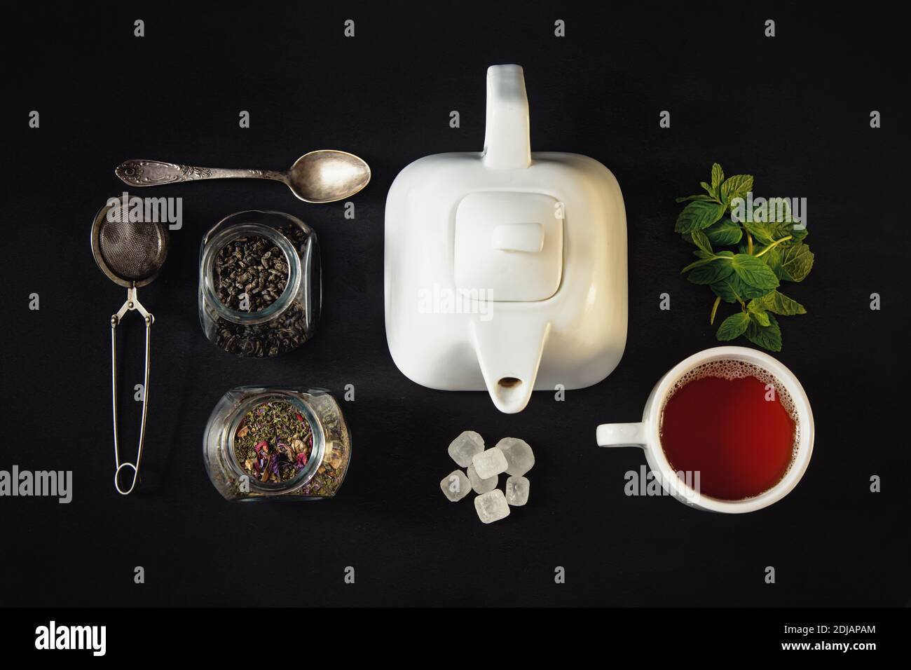 Flat lay of making tea. Isolated on black background. Topview, flat lay ...