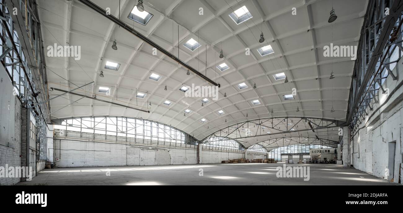 Huge industrial warehouse. White interior. Hemispherical reinforced ...