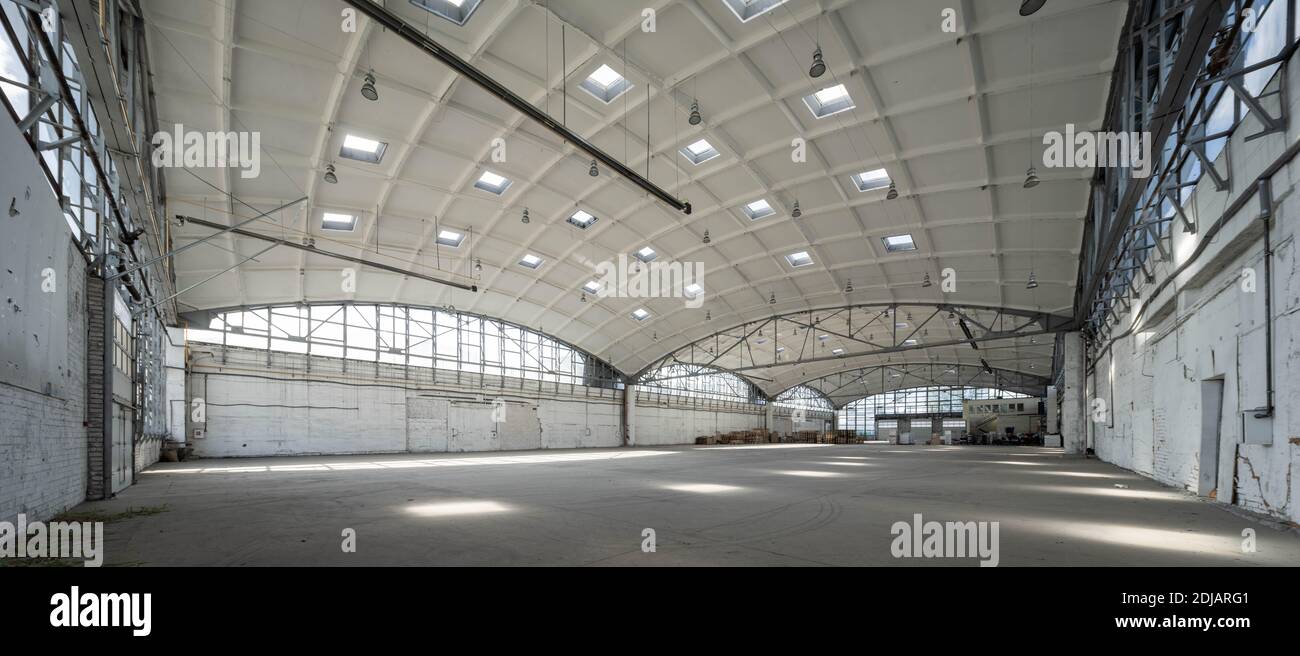 Huge industrial warehouse. White interior. Hemispherical reinforced ...