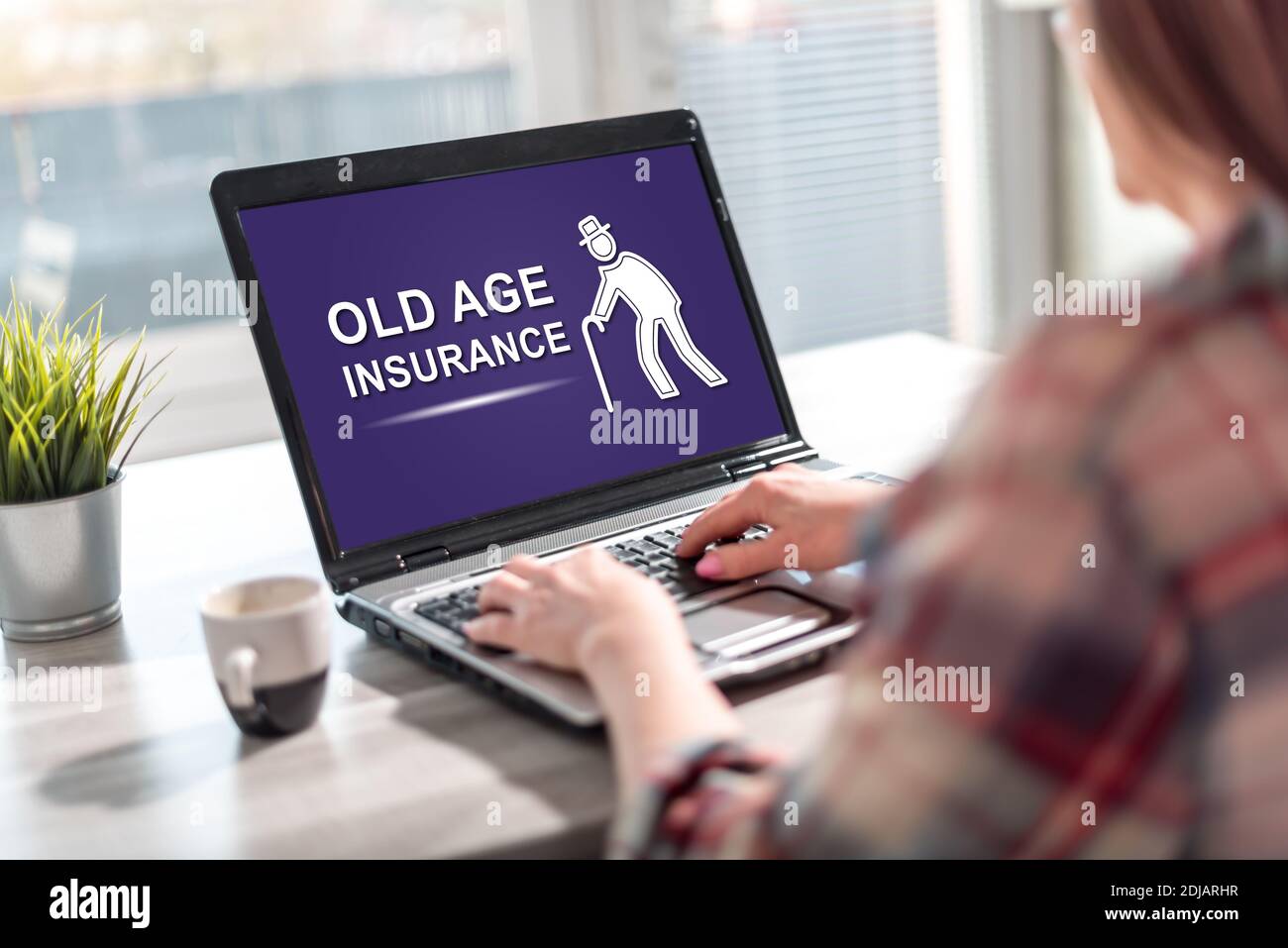 Laptop screen displaying an old age insurance concept Stock Photo - Alamy