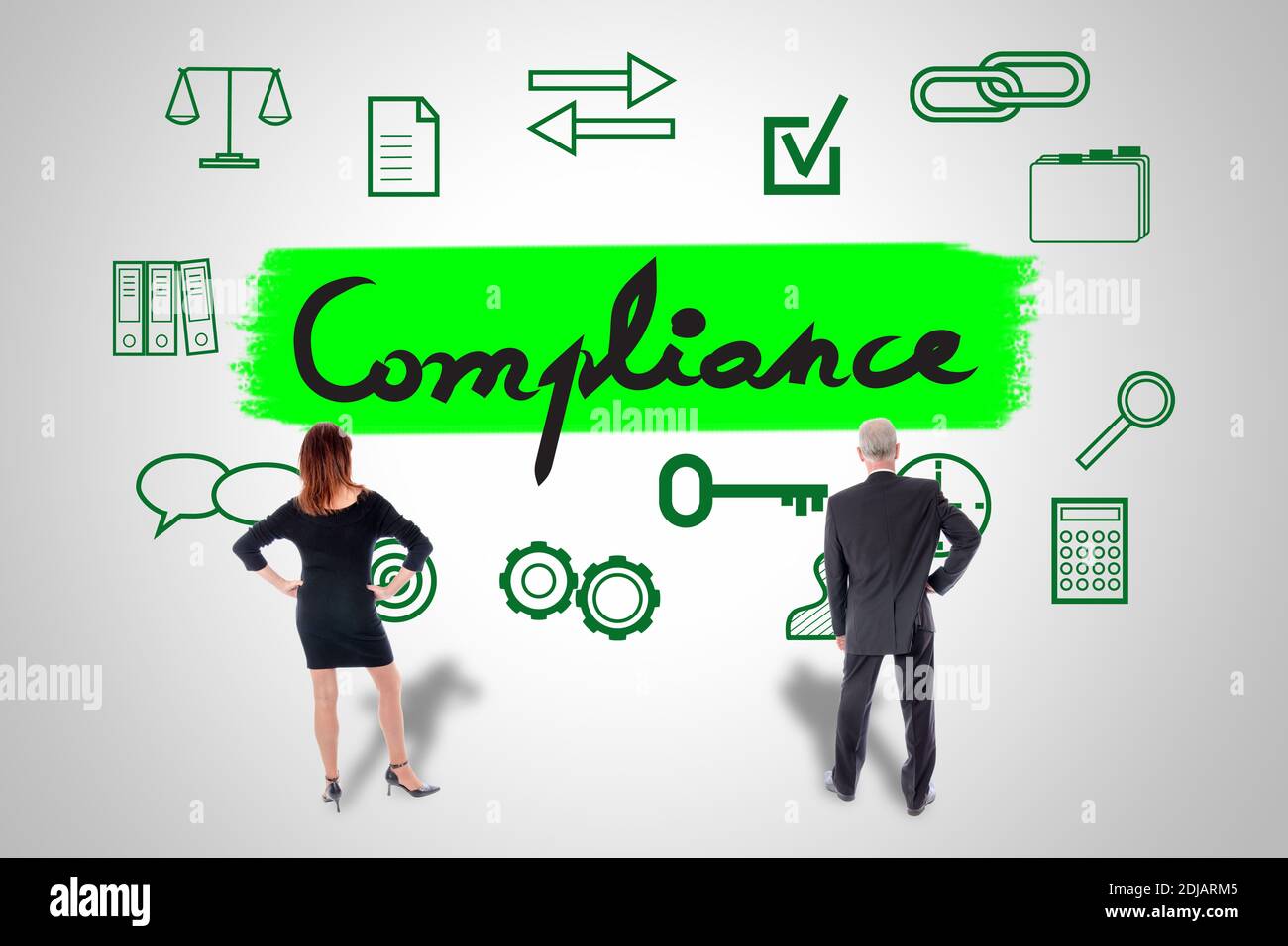 Compliance concept drawn on a wall watched by business people Stock ...