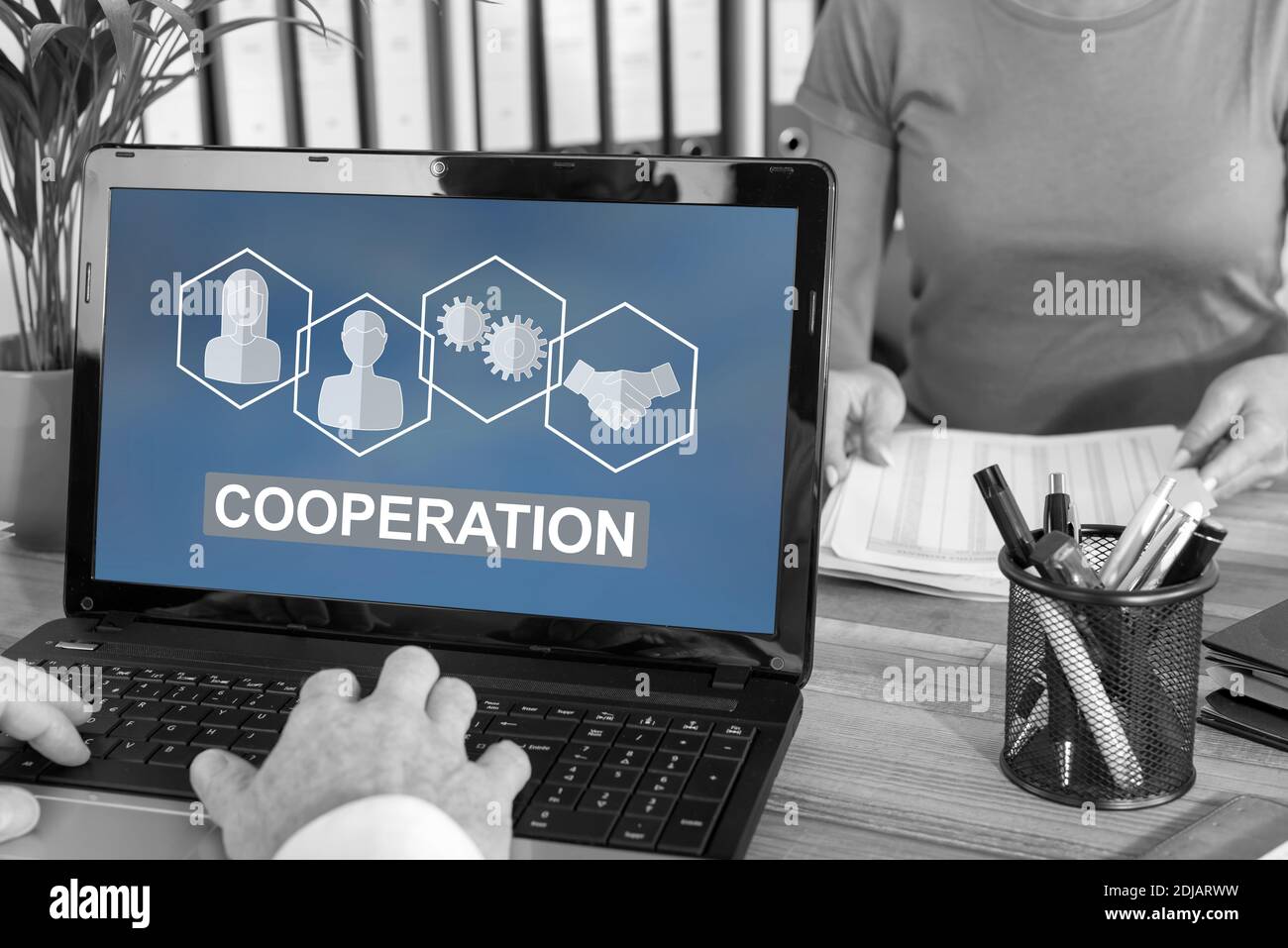 Laptop screen with cooperation concept Stock Photo - Alamy