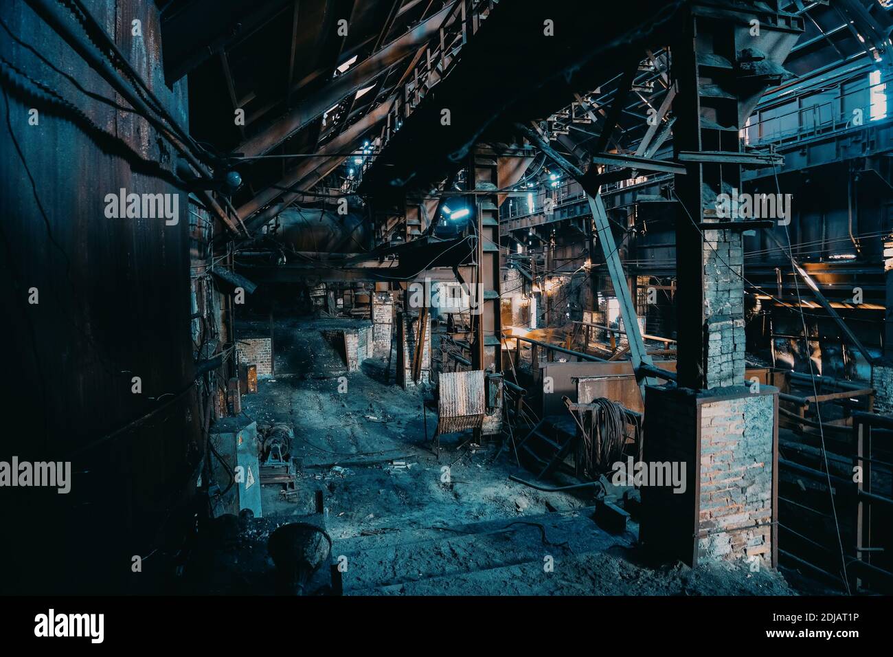 Large abandoned metallurgy factory workshop, hangar or warehouse inside ...