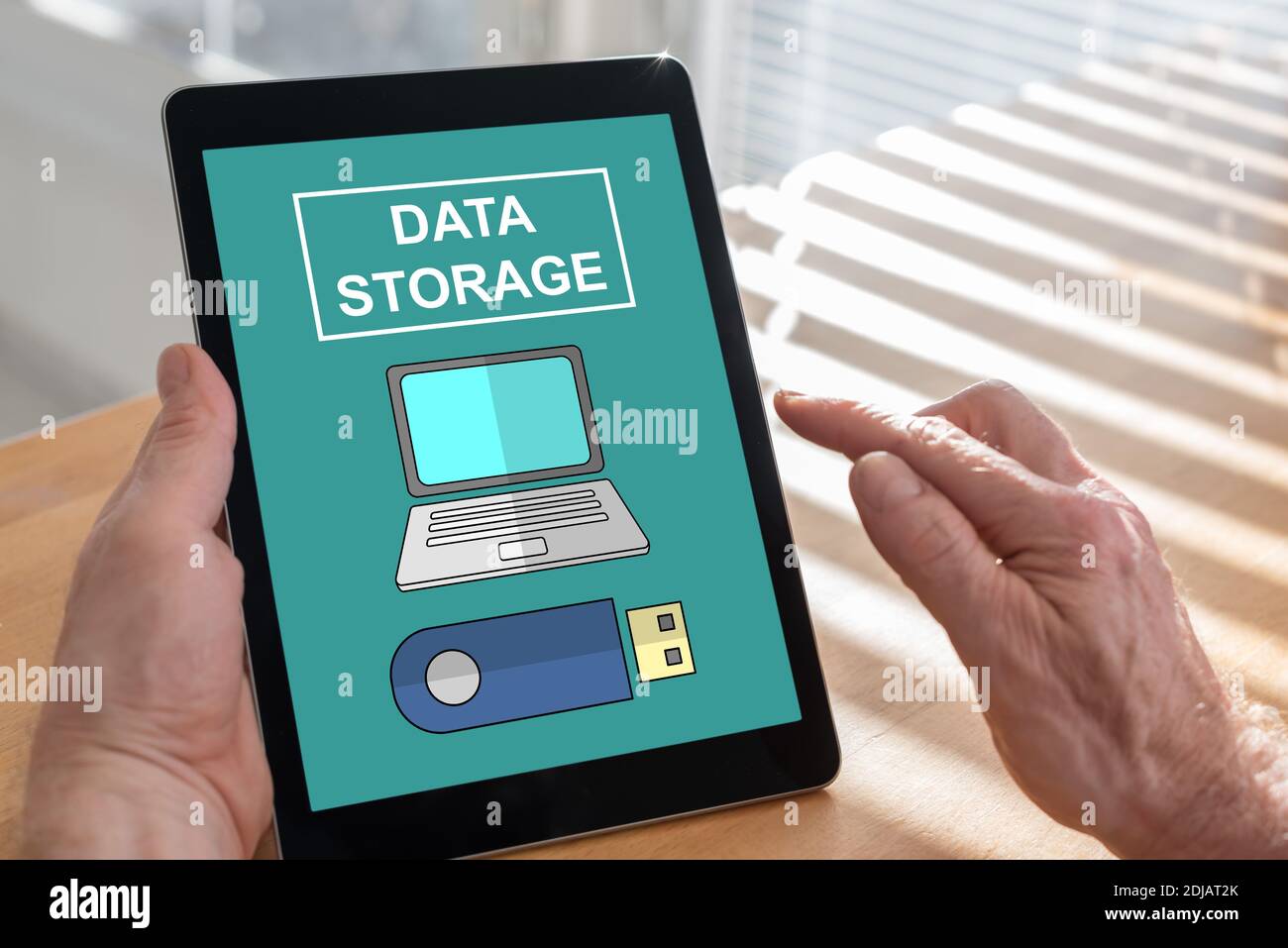 Tablet screen displaying a data storage concept Stock Photo - Alamy