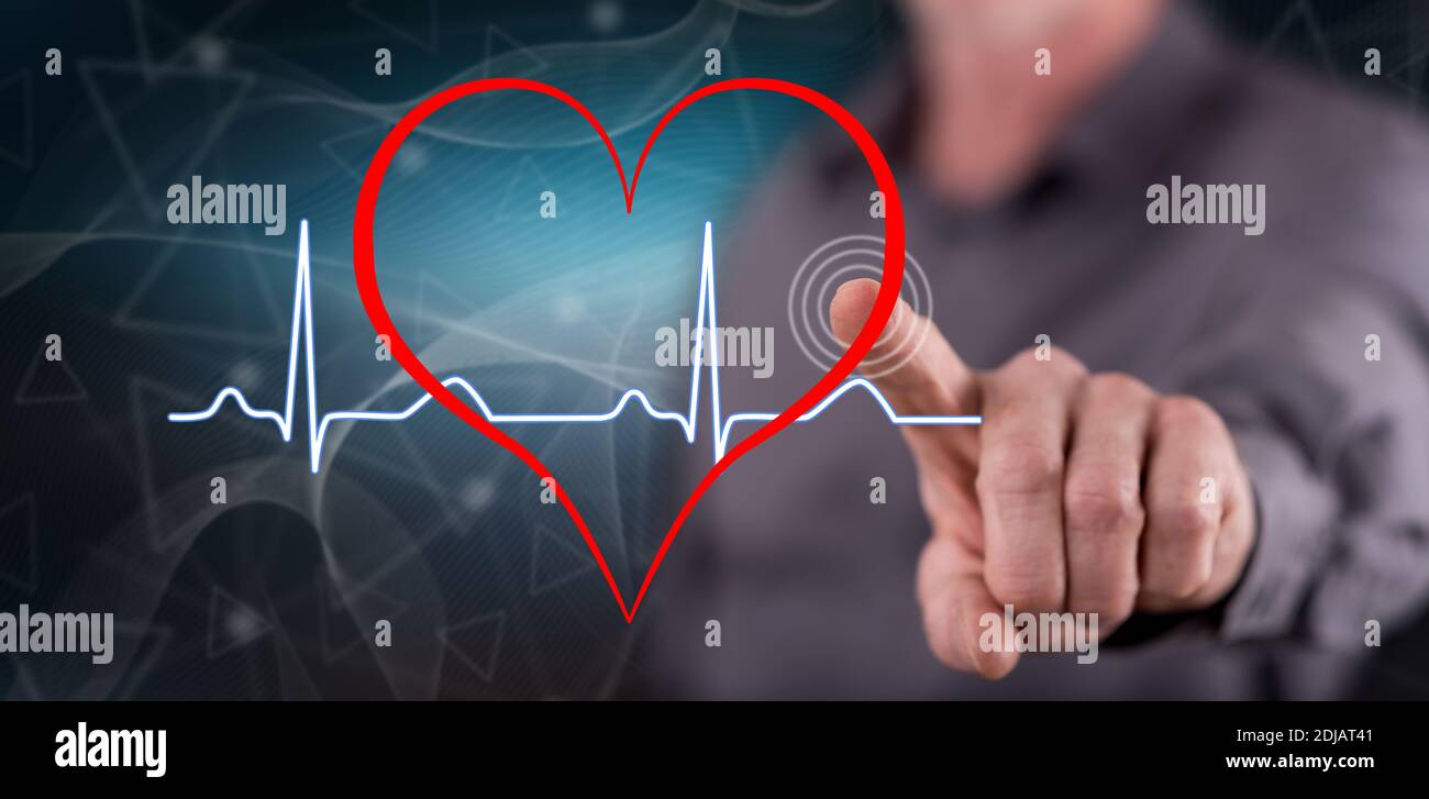 Man touching a heart beats graph on a touch screen with his finger ...