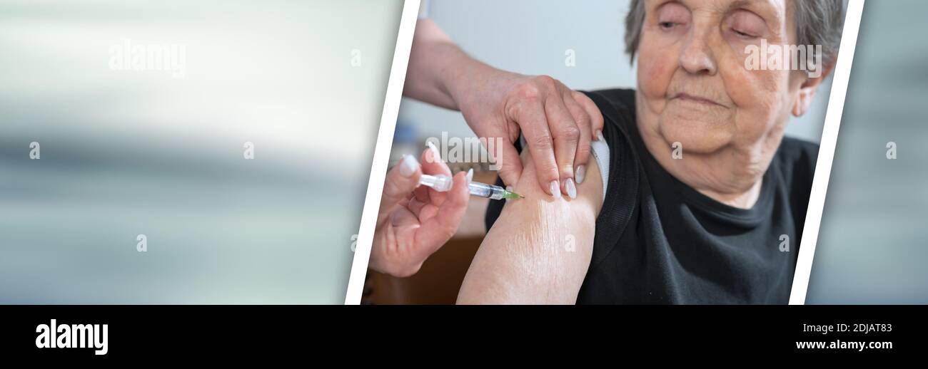 Nurse giving an injection to senior woman. panoramic banner Stock Photo ...