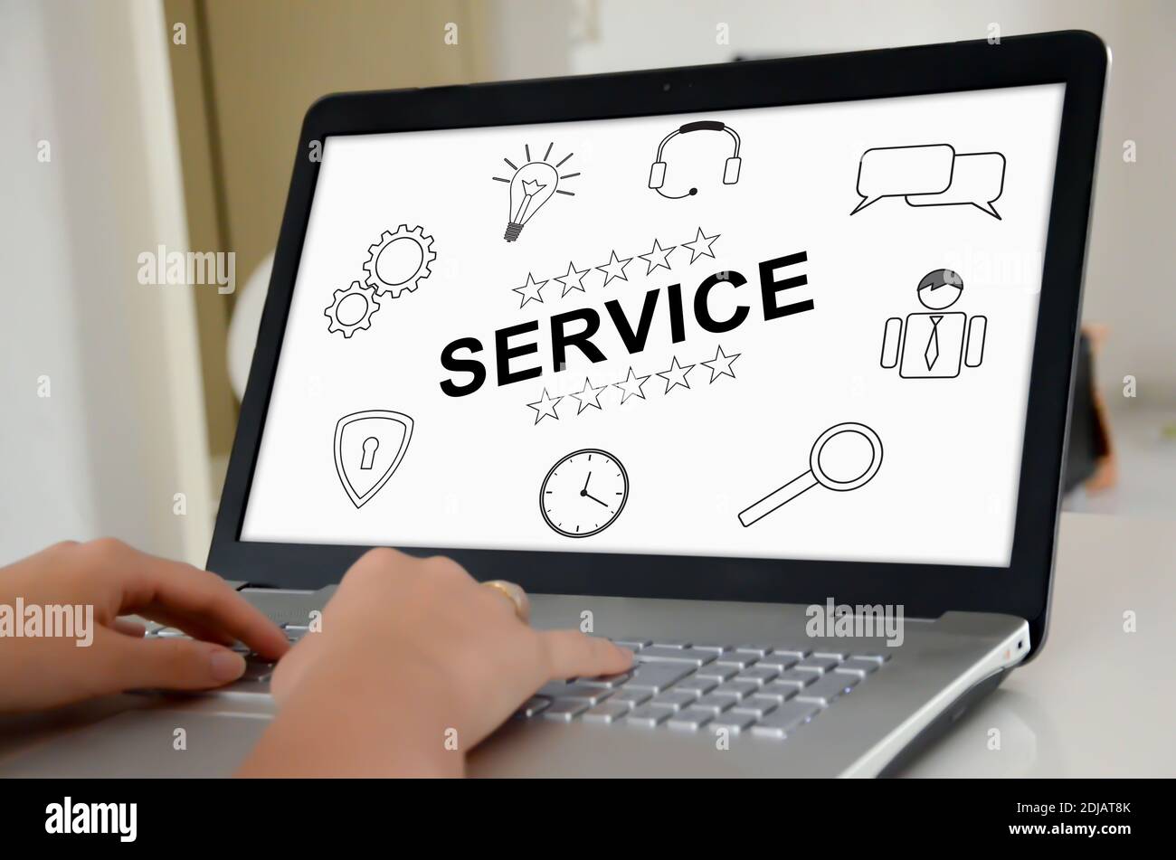 Hands on a laptop with screen showing service concept Stock Photo - Alamy