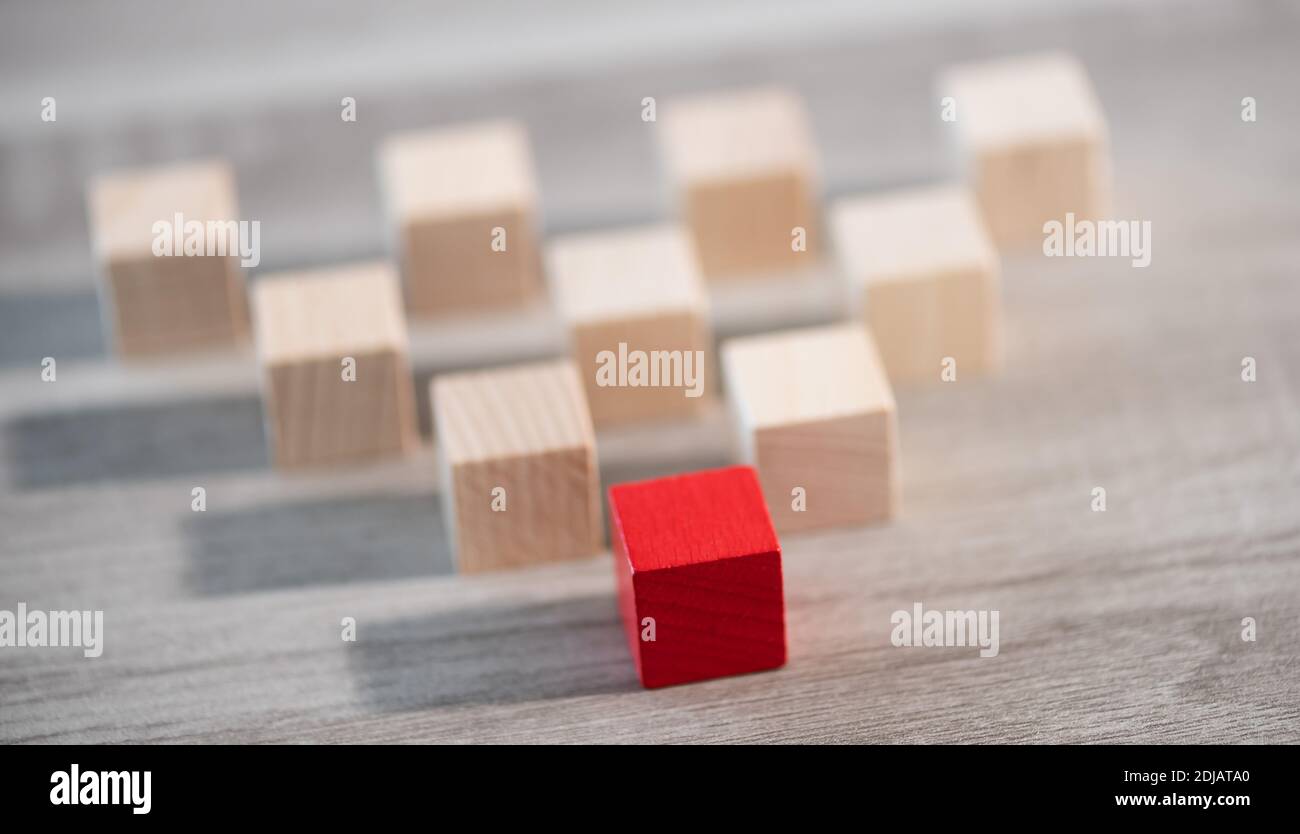 Concept of leadership with wooden cubes Stock Photo - Alamy
