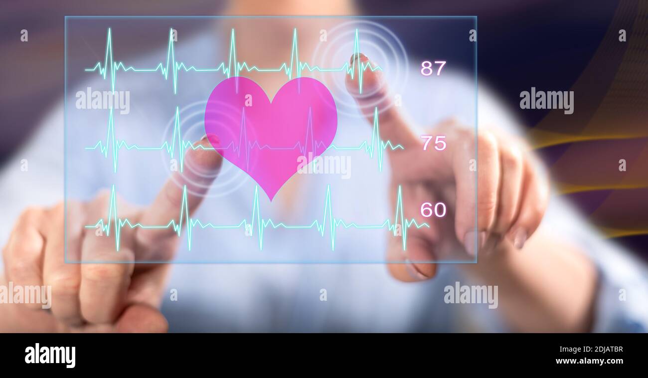 Woman touching a heart beats graph concept on a touch screen with her ...