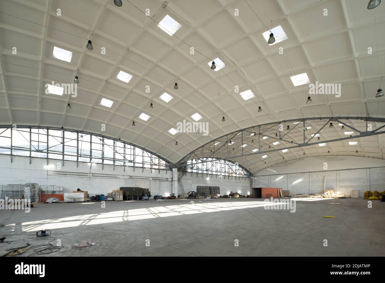 Huge industrial warehouse. Green truck. Unique architecture ...