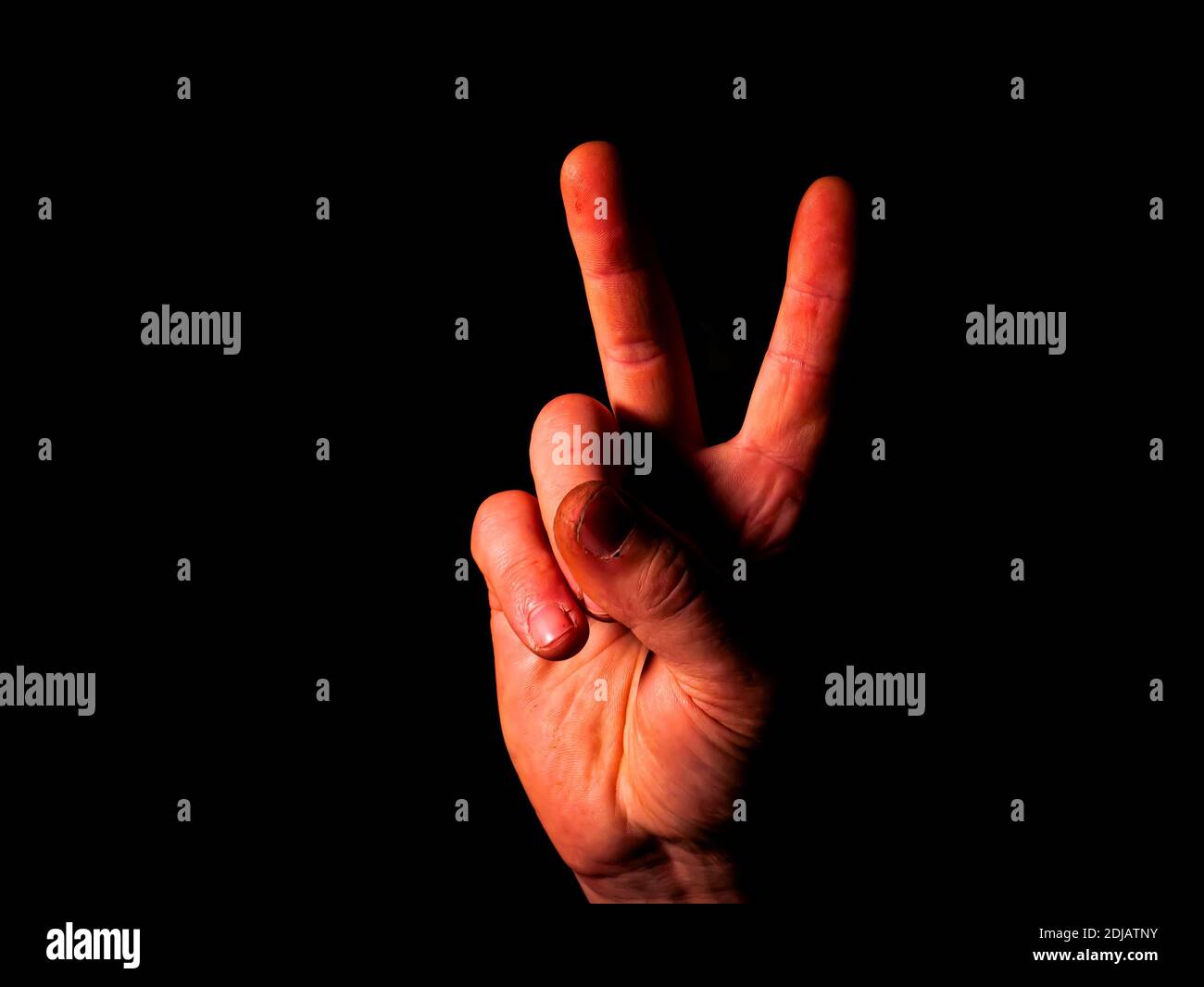 Gesture symbol victory male hand on a black background. Gesture victory ...