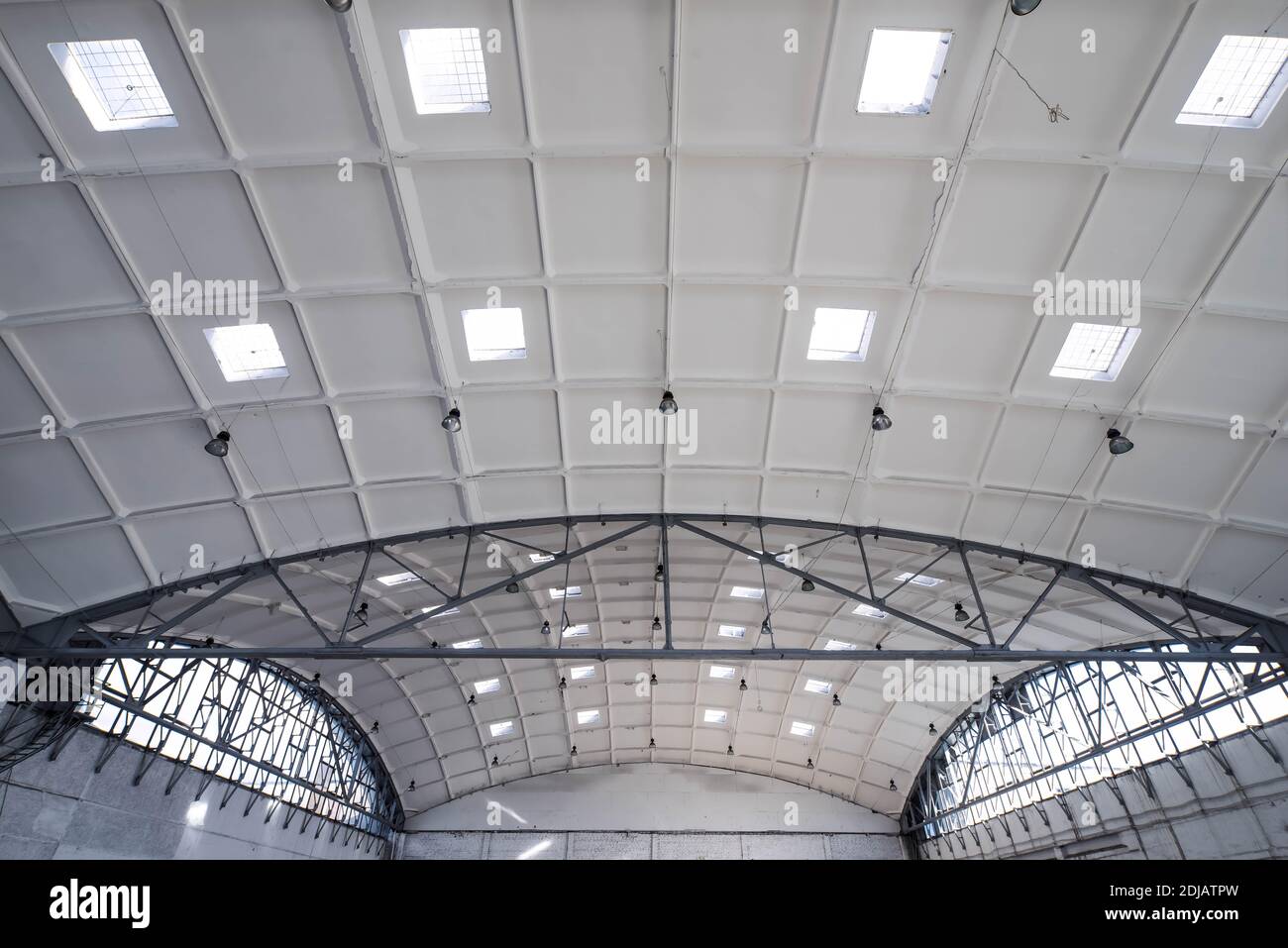 Hemispherical reinforced concrete load bearing roof with windows in ...